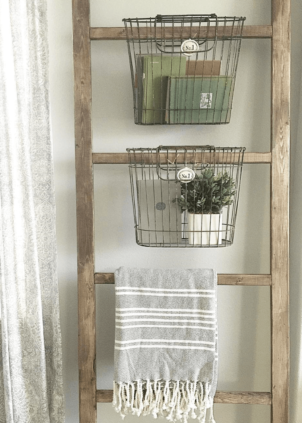 A blanket ladder with added wire baskets | The Odyssey Online
